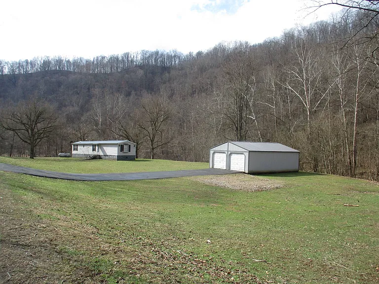 57 Acres with Mobile Home, Garage & Stream Access – Just $190,000 ...